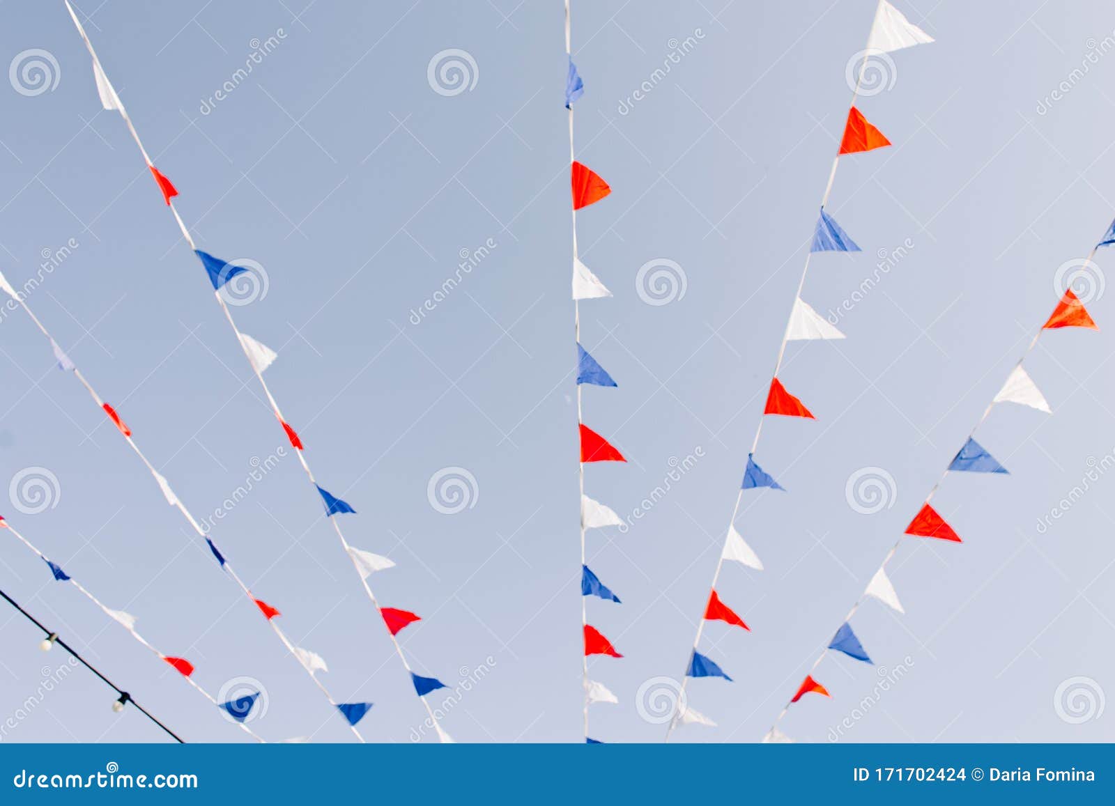 Multicolored Flags Flutter in the Wind Over a Street Fair Stock Photo ...
