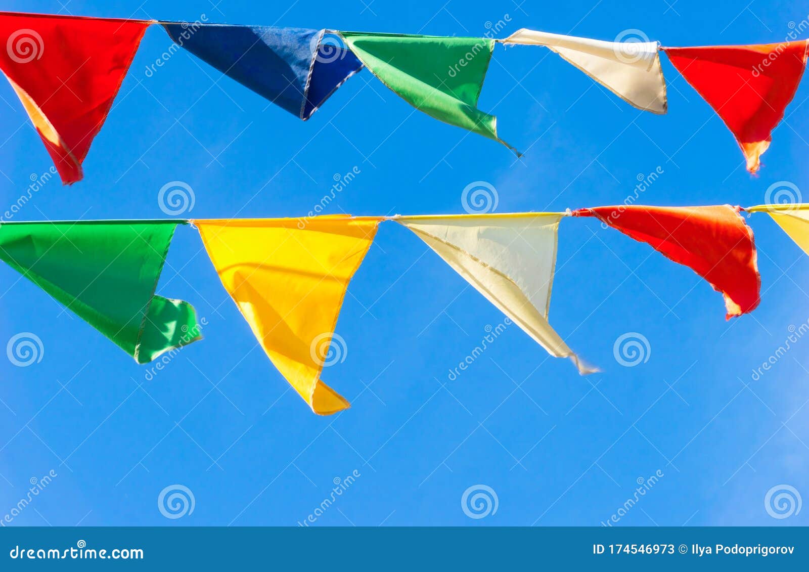 Multicolored Flags a Triangular Shape Against the Blue Sky. Good ...