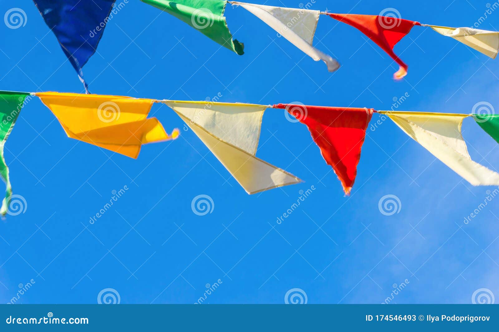 Multicolored Flags a Triangular Shape Against the Blue Sky. Good ...