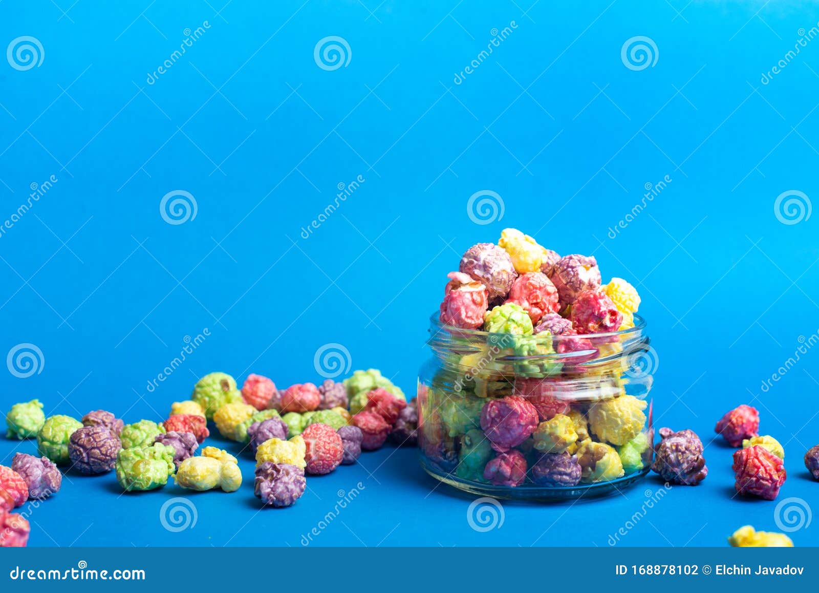 Multicolored Fruit Flavored Popcorn in Glass Cups on Blue Background ...