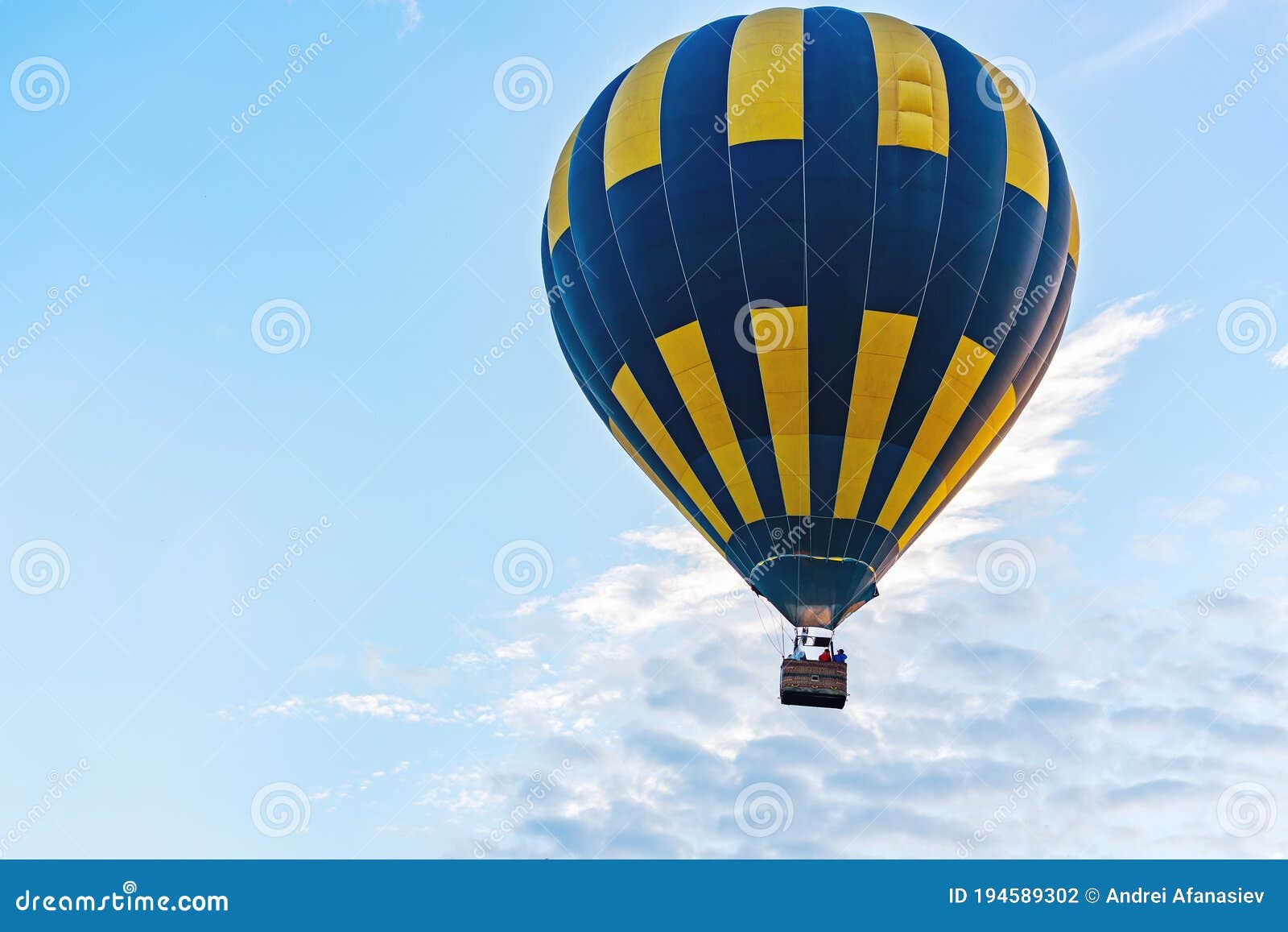 Multicolored Hot Air Balloon on Blue Cloudy Sky Background Stock Photo ...