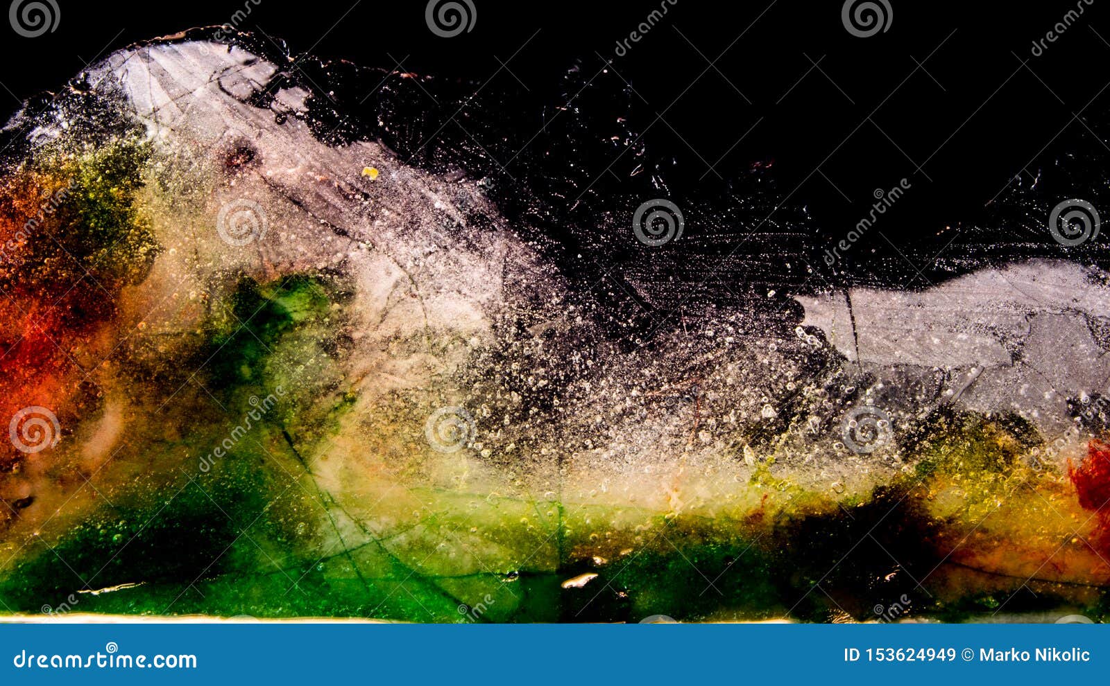 Multicolored Ice Plate Melting in Various Colors. Beautiful Ice ...