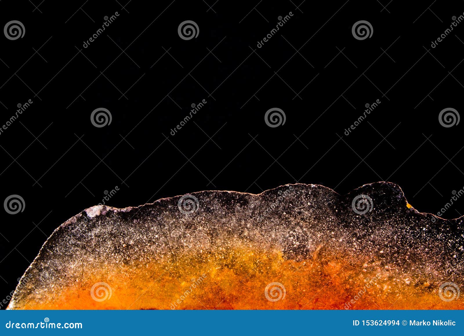 Multicolored Ice Plate Melting in Various Colors. Beautiful Ice ...