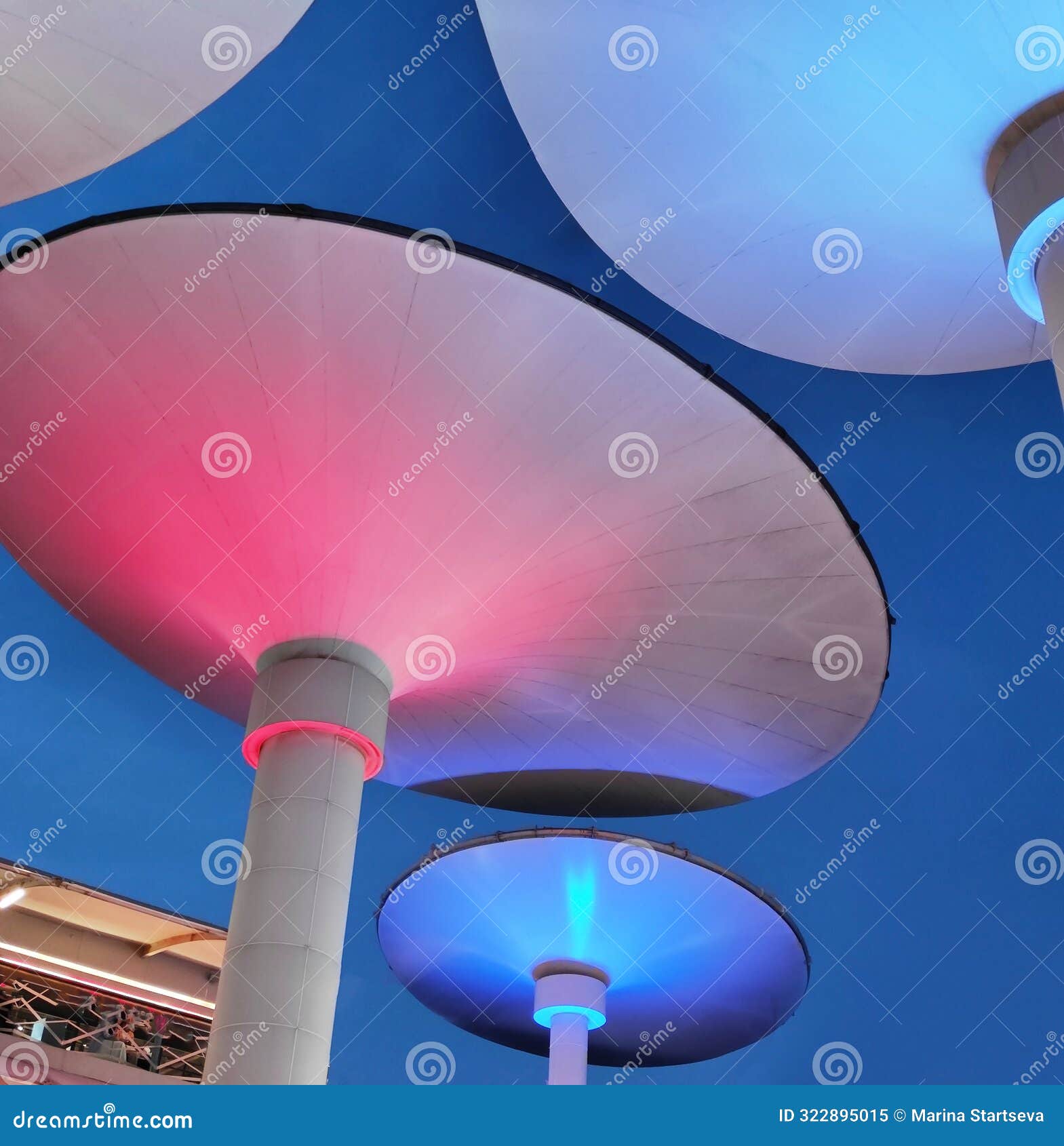 Multicolored Lamp Lighting in the Shape of Round Plates, on Blue ...