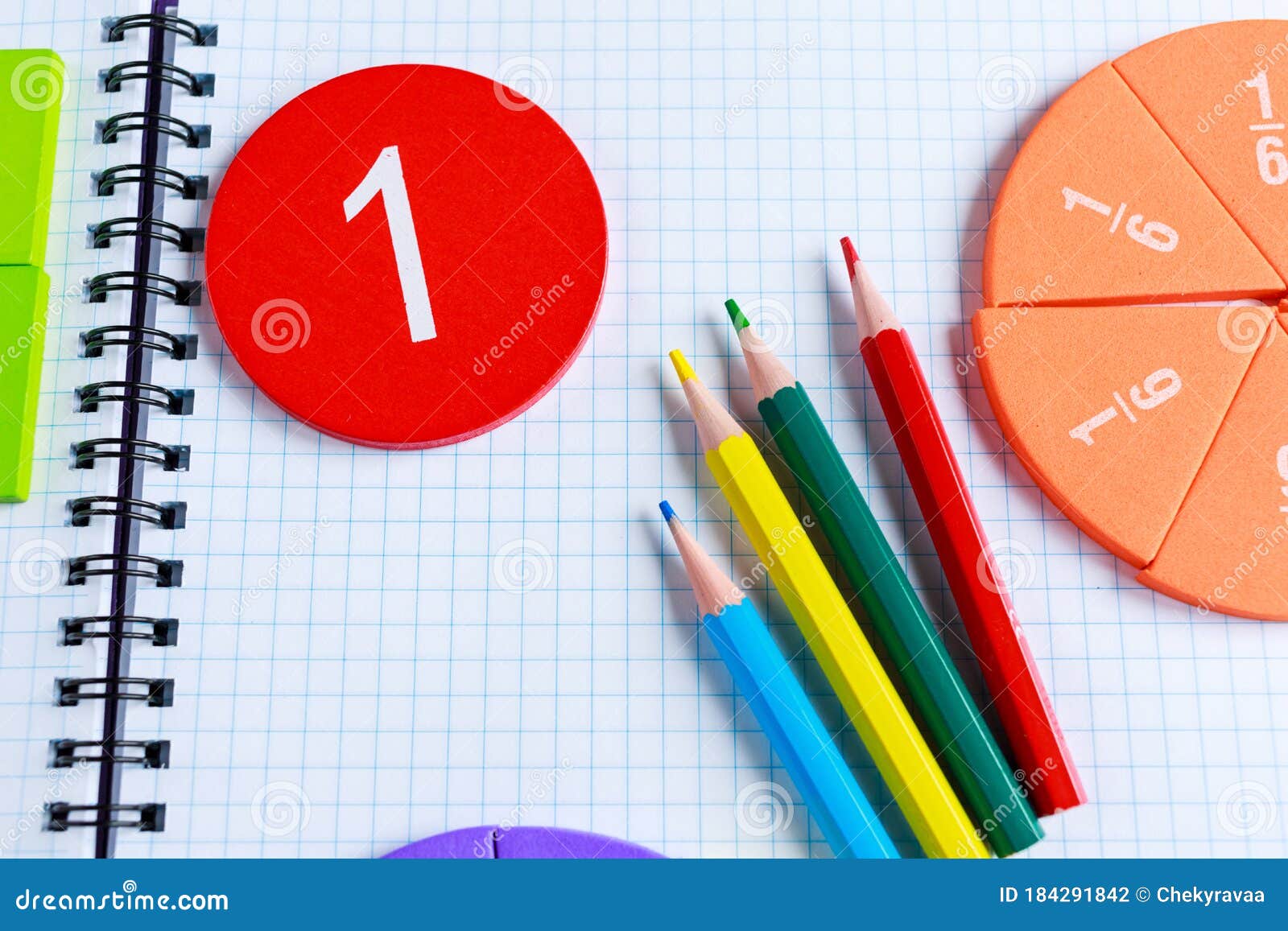 Multicolored Math Fractions on the Open Notepad on Gray Wooden Table ...