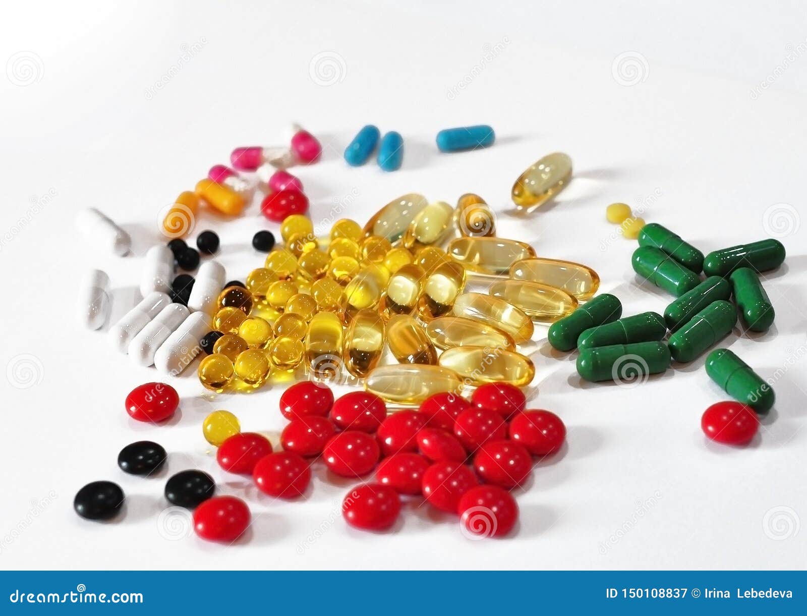 Multicolored Medicinal Capsules and Tablets Scattered on the Table ...
