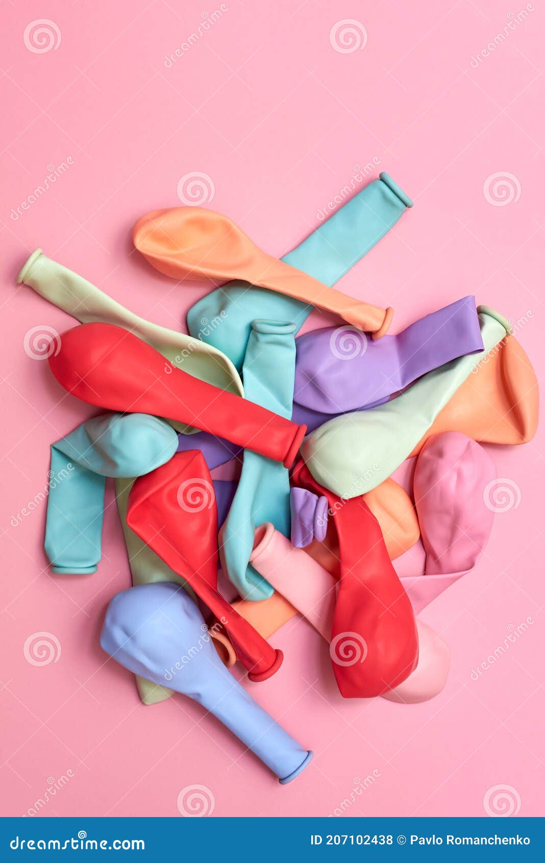 Multicolored Not Inflated Balloons on a Pink Background Stock Photo ...
