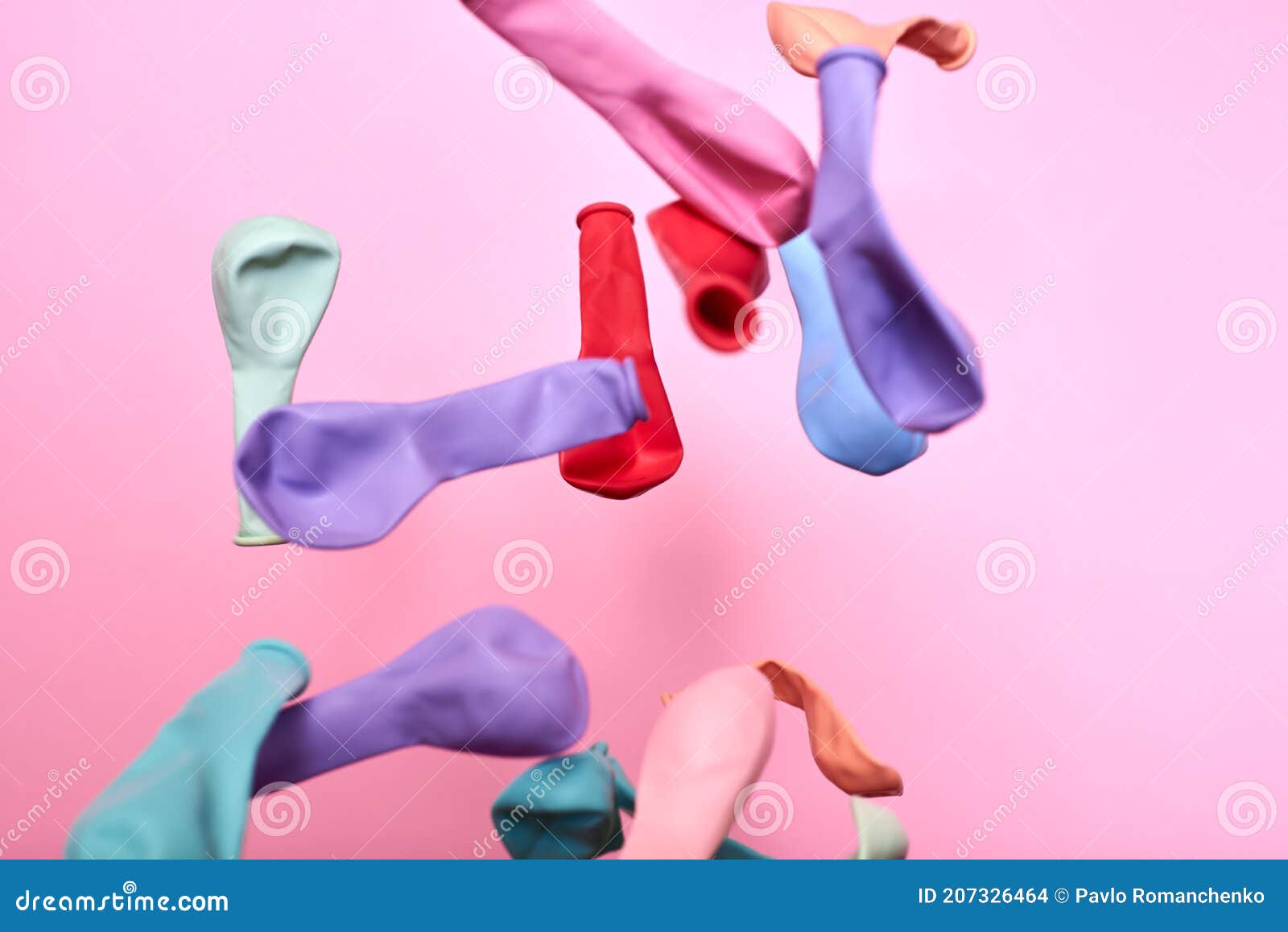 Multicolored Not Inflated Balloons Thrown into the Air on a Pink ...