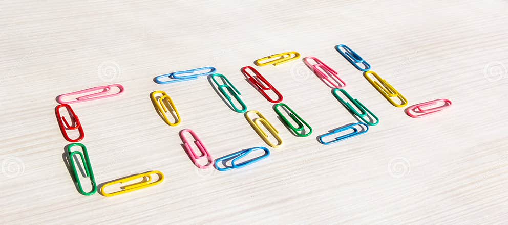 Multicolored Paper Clips. Paper Clip Word Cool on a Light Table. Word ...