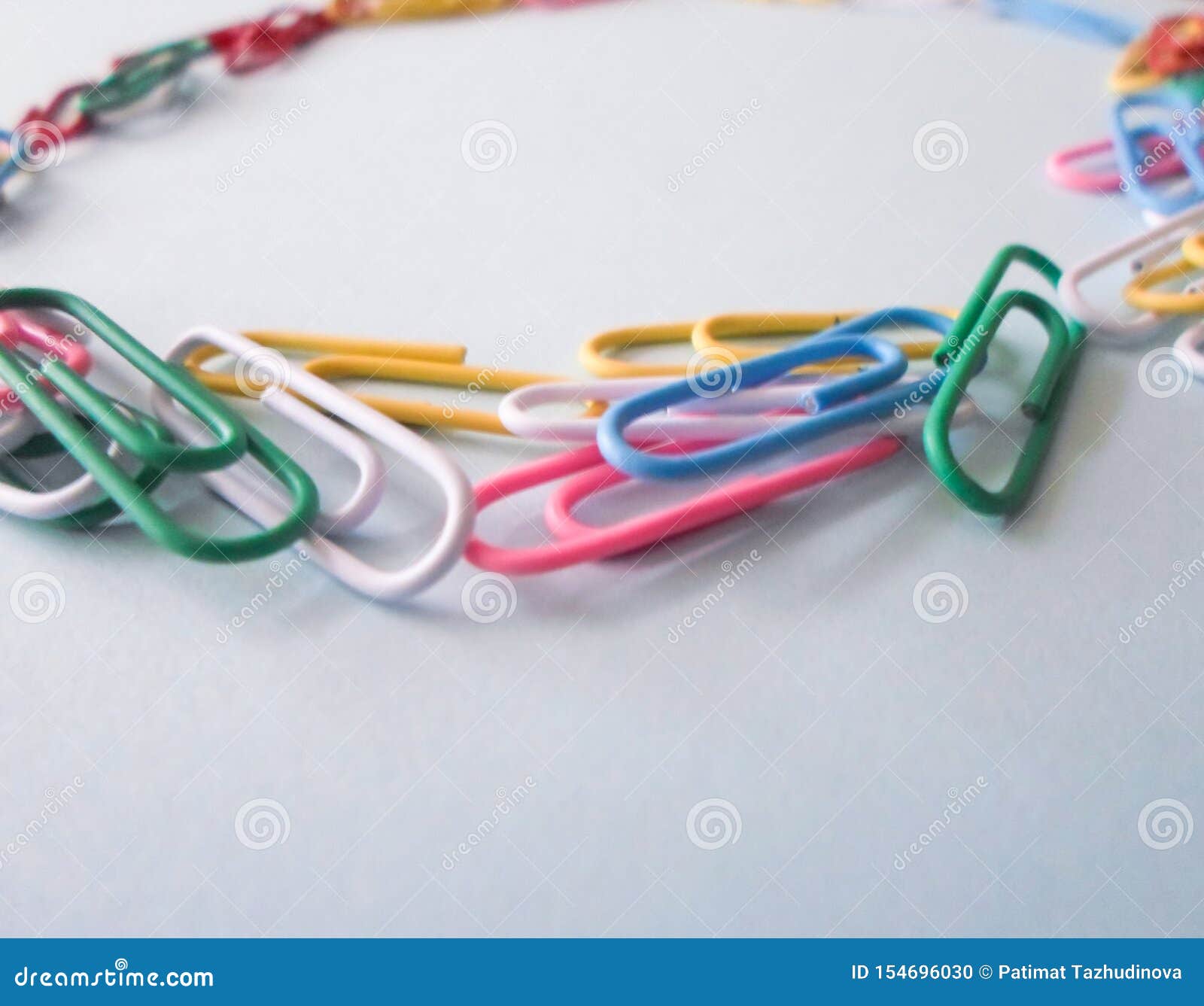 Multicolored Paper Clips on a White Background in the Form of a Circle ...