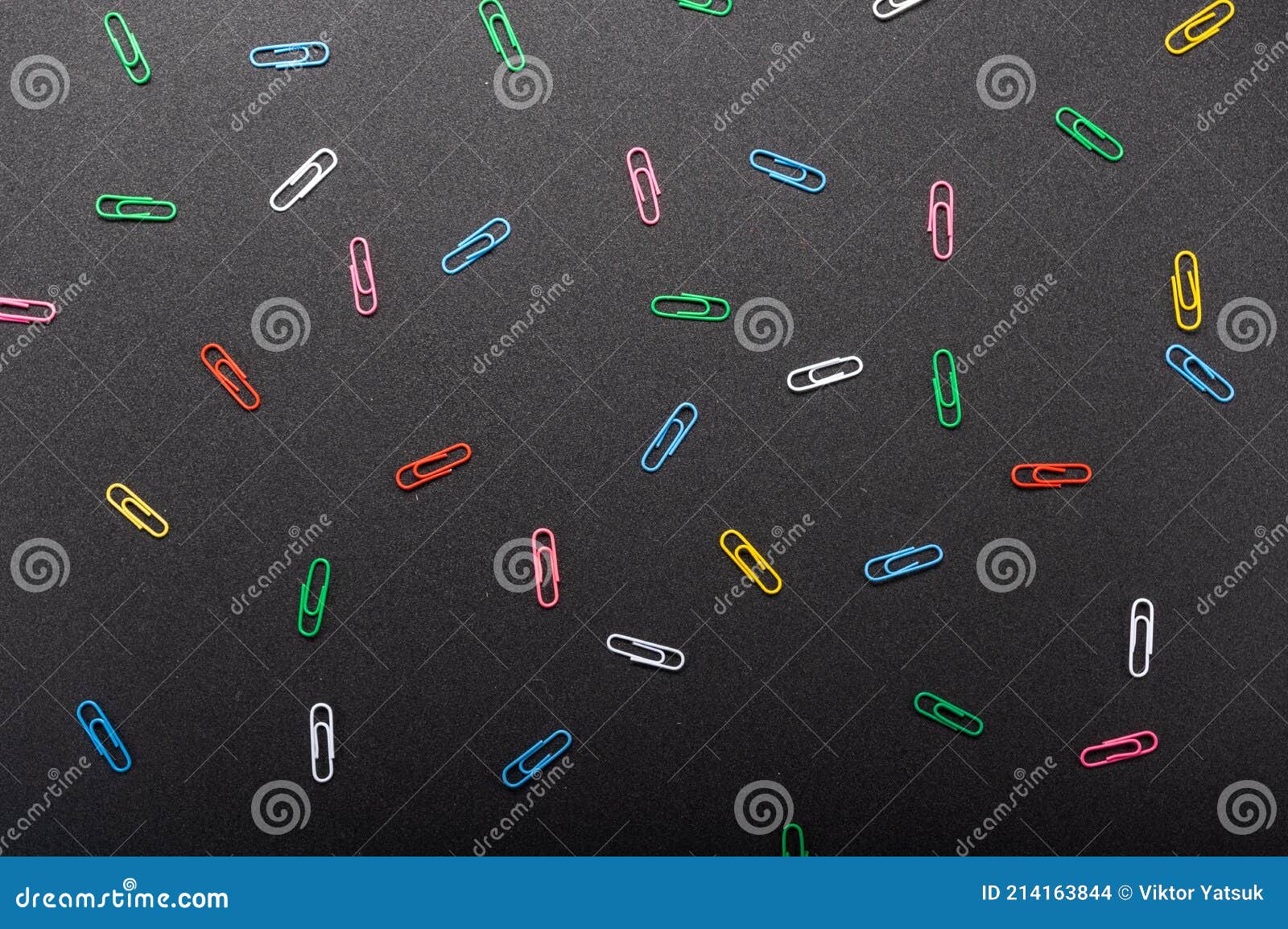 Multicolored Pattern on a Black Background. Multi-colored Paper Clips ...
