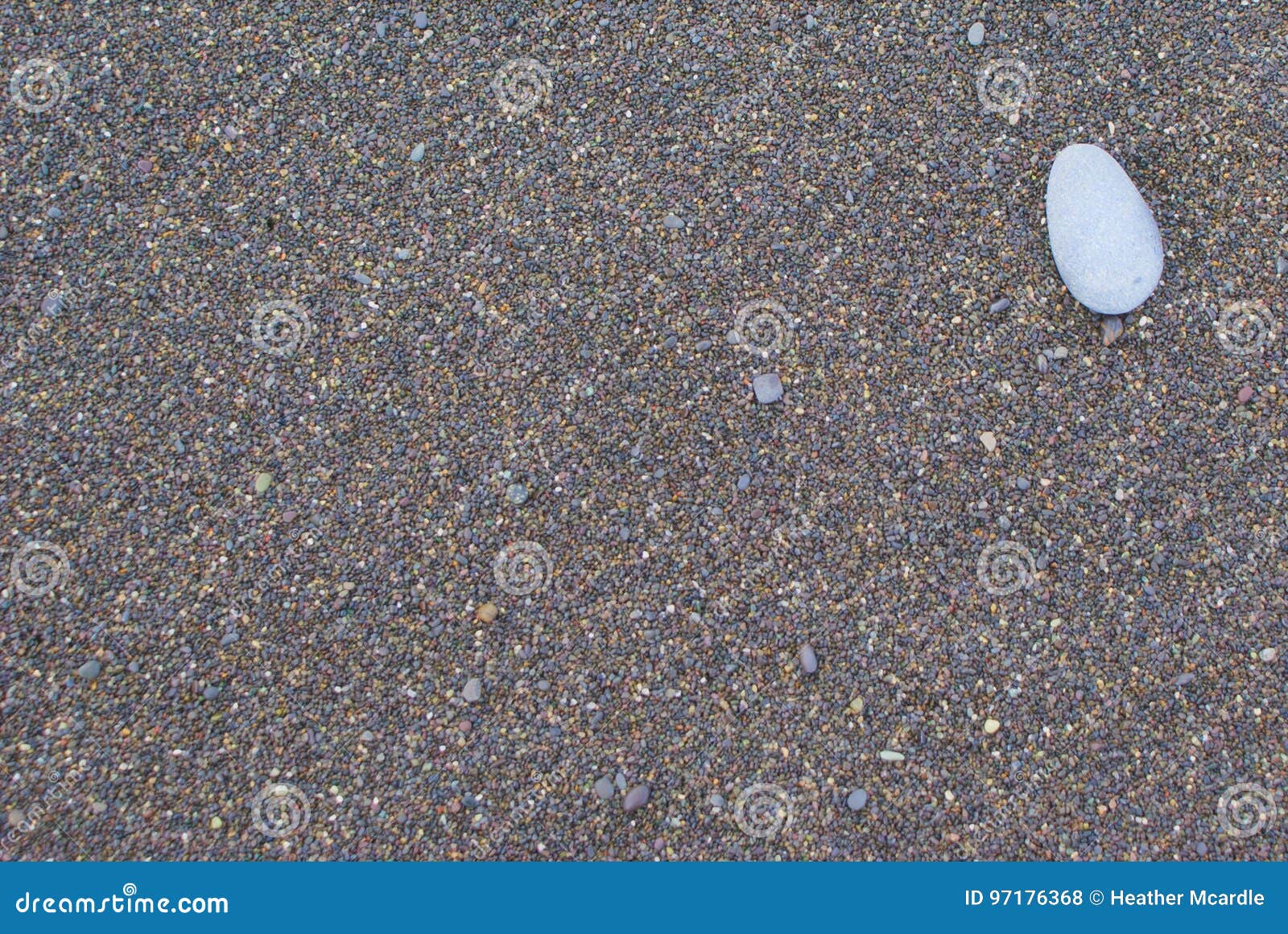 Aerial View of Multicolored Pebbles and Stones with Larger Blue Rounded ...