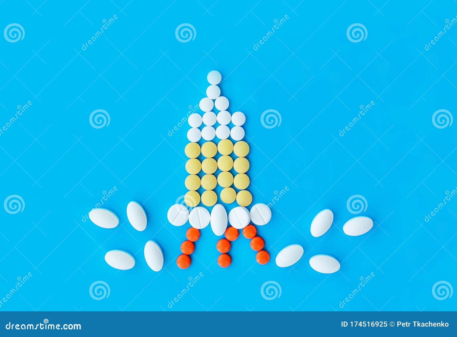 Multicolored Pills in the Form of a Rocket on a Blue Background with a ...