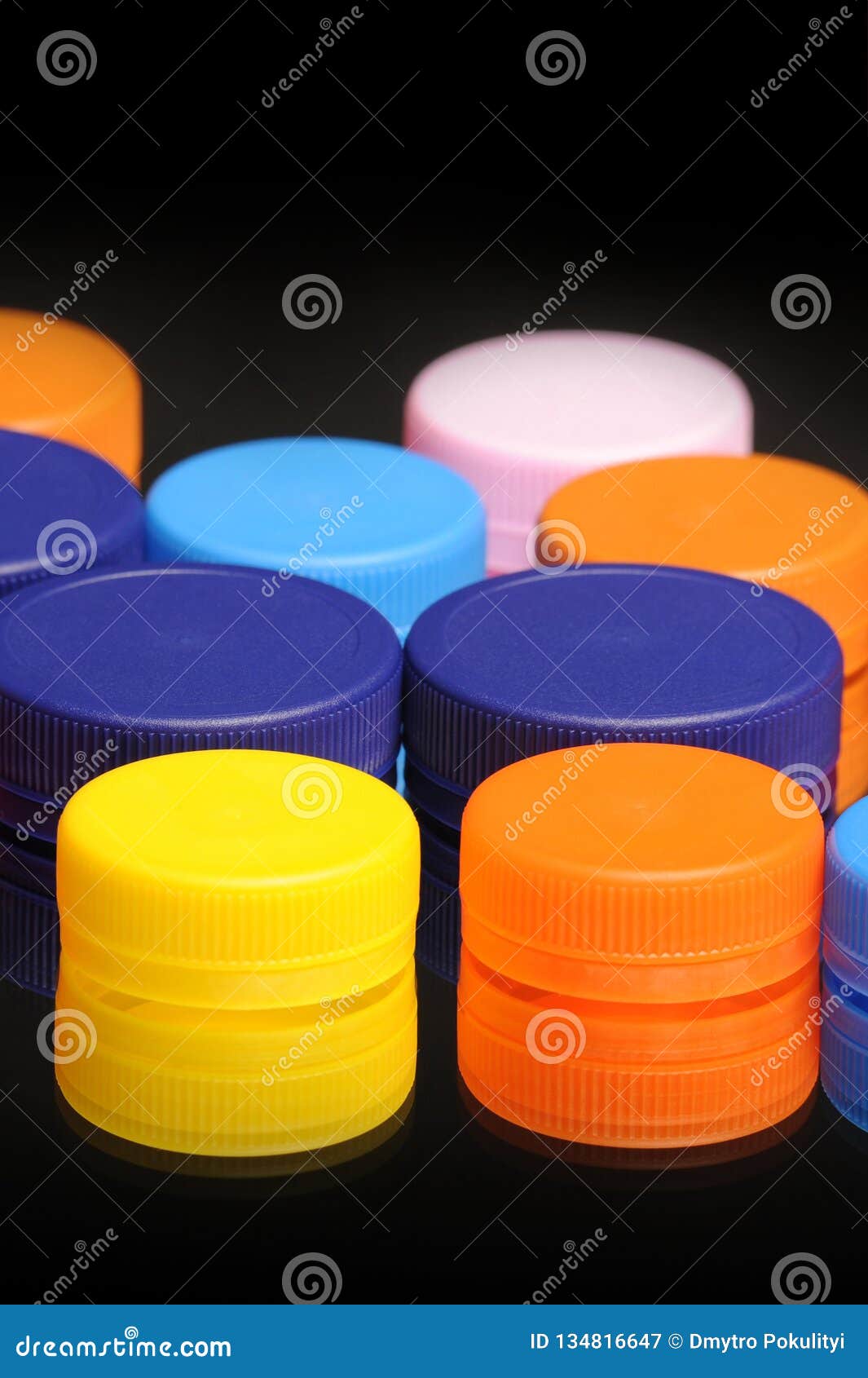 Stack of Colorful Plastic Bottle Caps on Black Stock Image - Image of ...