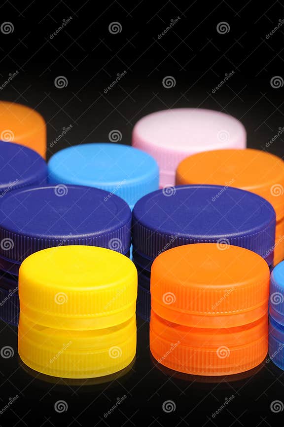 Stack of Colorful Plastic Bottle Caps on Black Stock Image - Image of ...