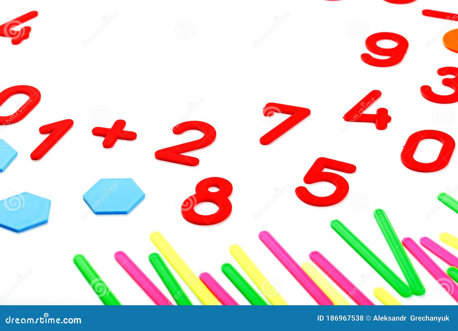 Multicolored Plastic Figures and Numbers on a White Background ...