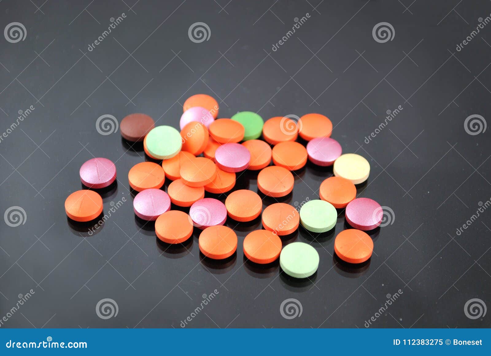 Multicolored round tablets stock image. Image of medication - 112383275