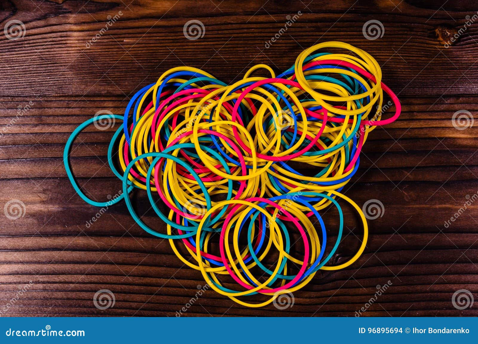 Multicolored Rubber Bands on Wooden Table. Top View Stock Photo - Image ...