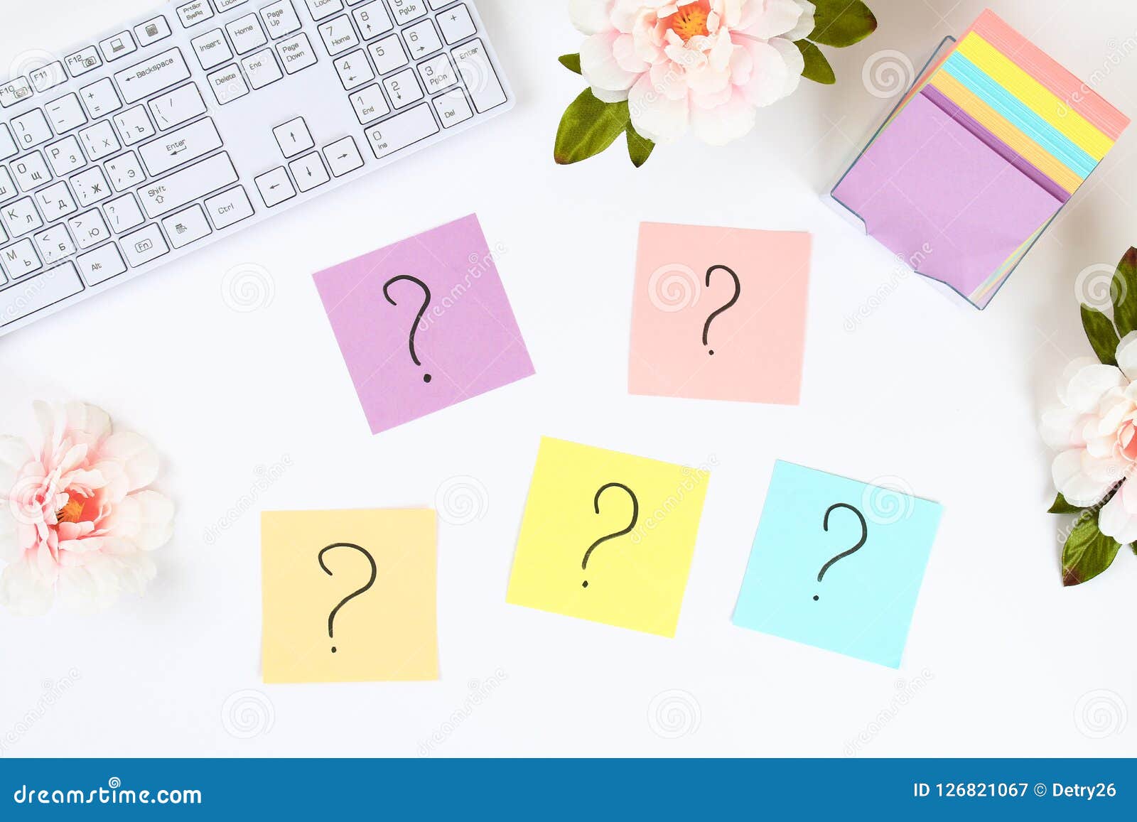 Multicolored Stickers Note with Question Mark on White Desktop Next To ...