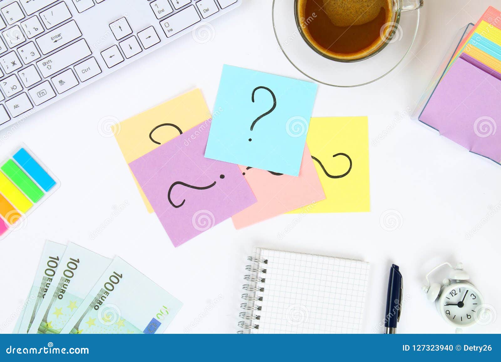 Multicolored Stickers Note with Question Mark on White Desktop Next To ...
