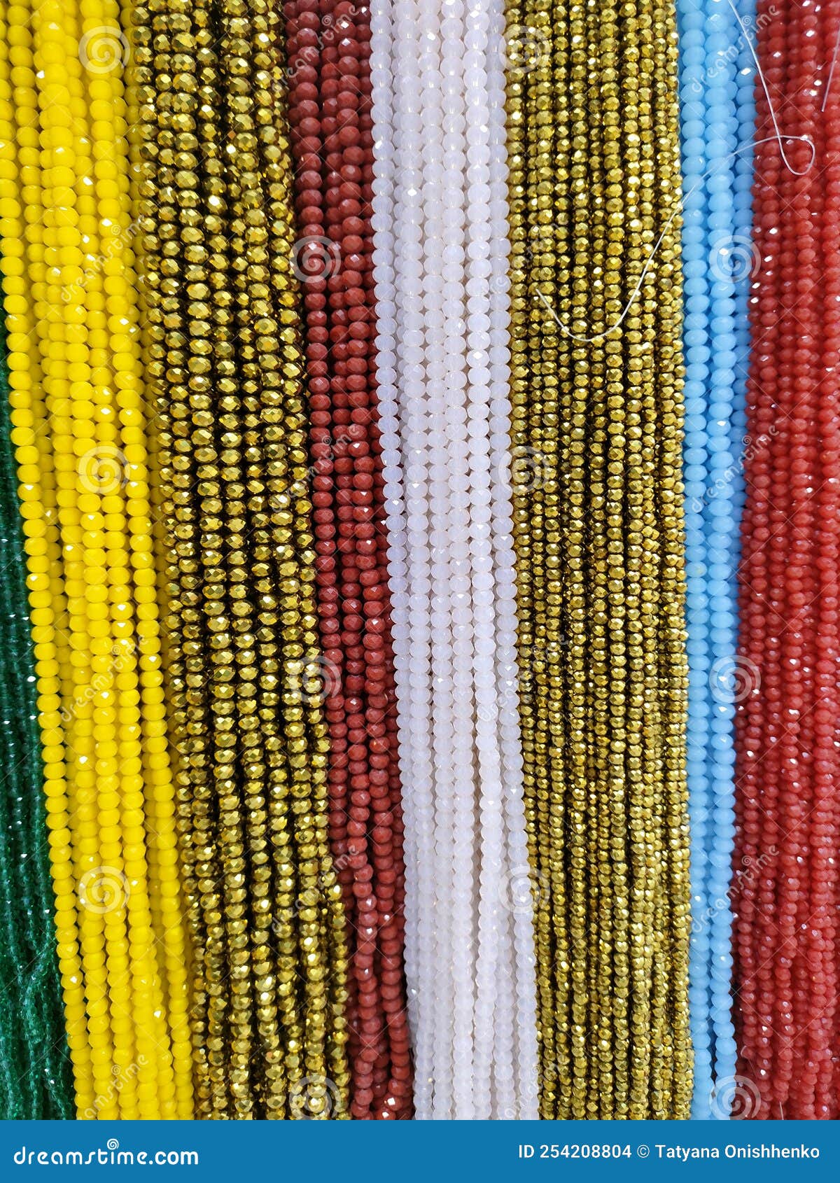 Multicolored Threads with Beads Hanging in Rows on the Wall Stock Photo ...