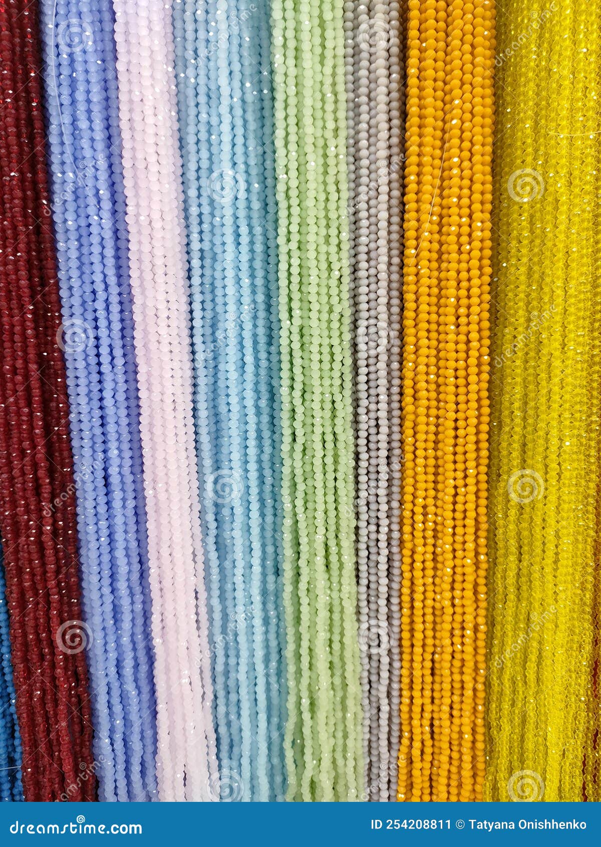 Multicolored Threads with Beads Hanging in Rows on the Wall Stock Image ...