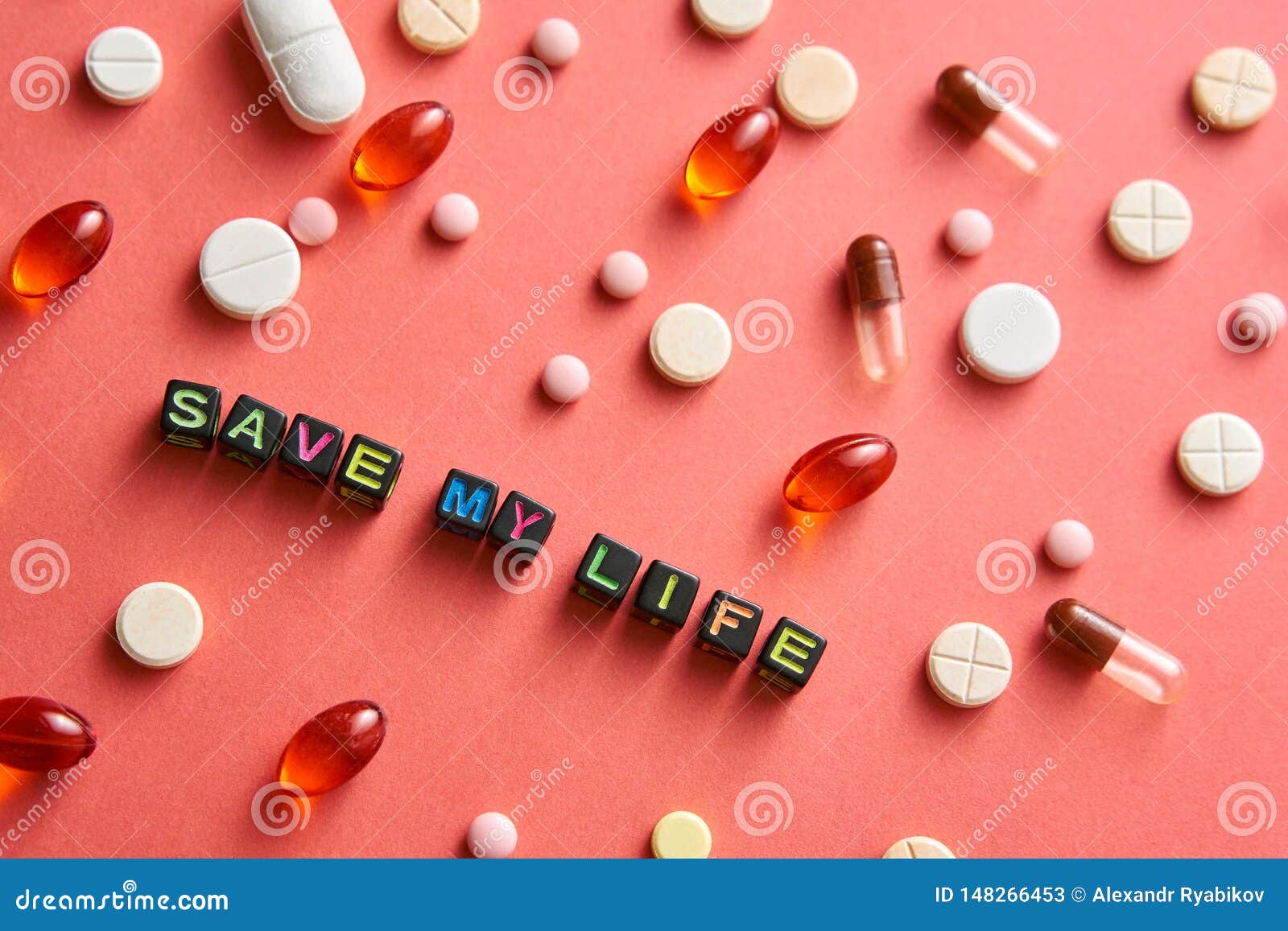 Multicolored Title SAVE MY LIFE from Black Cubes on the Table with ...