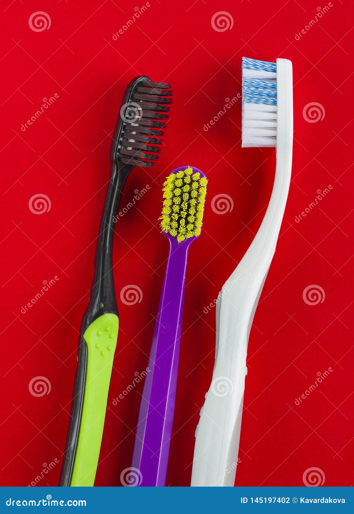 Multicolored Toothbrushes on a Red Background Stock Photo - Image of ...