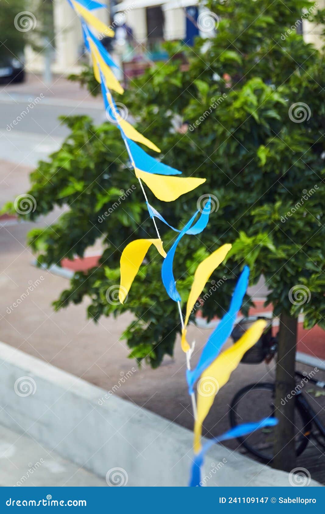 Multicolored Triangular Flags on a Rope in the Park. Festive Garland on ...