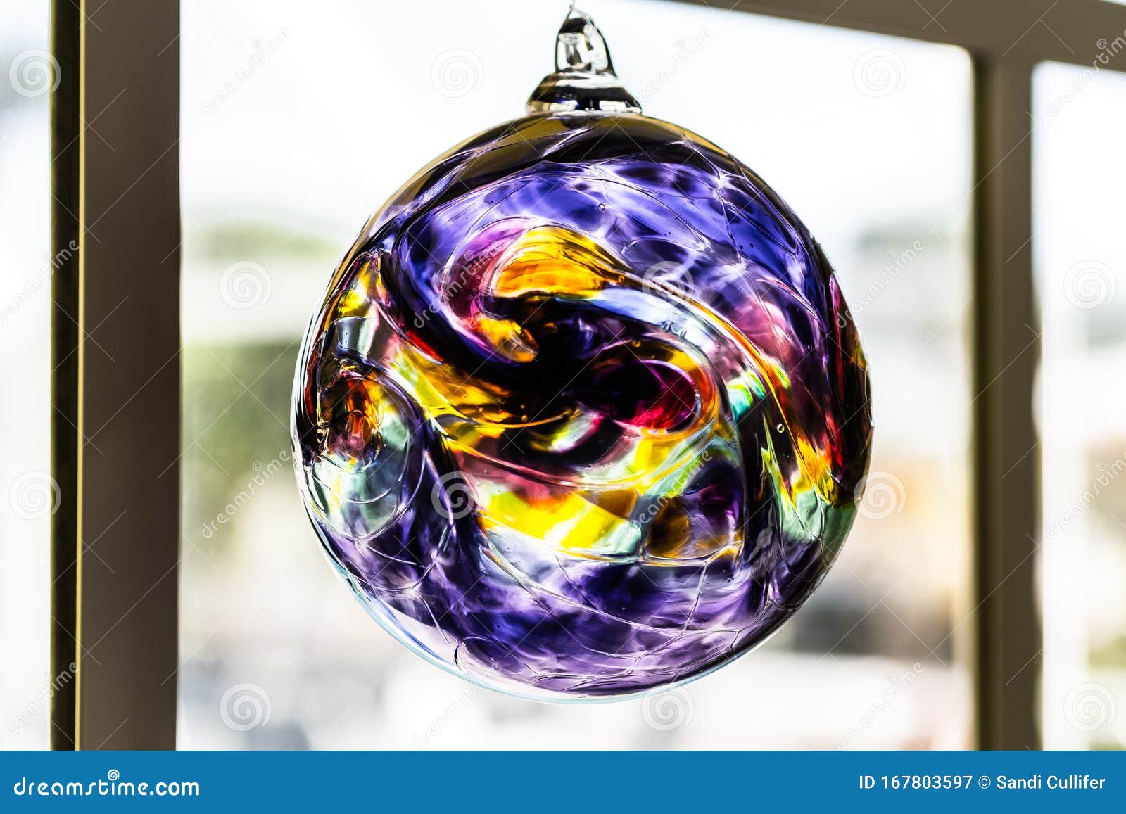 Blown Glass Sun Catcher in the Window Stock Image - Image of round ...