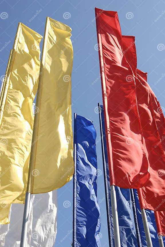 Multicoloured Narrow Long Flags Against Blue Sky Stock Image - Image of ...