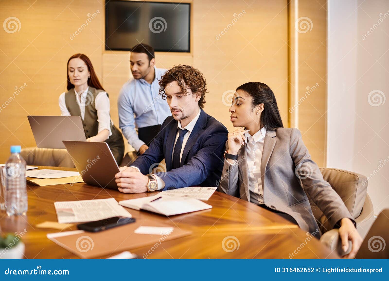 Multicultural Business Professionals Collaborating at Conference Stock ...