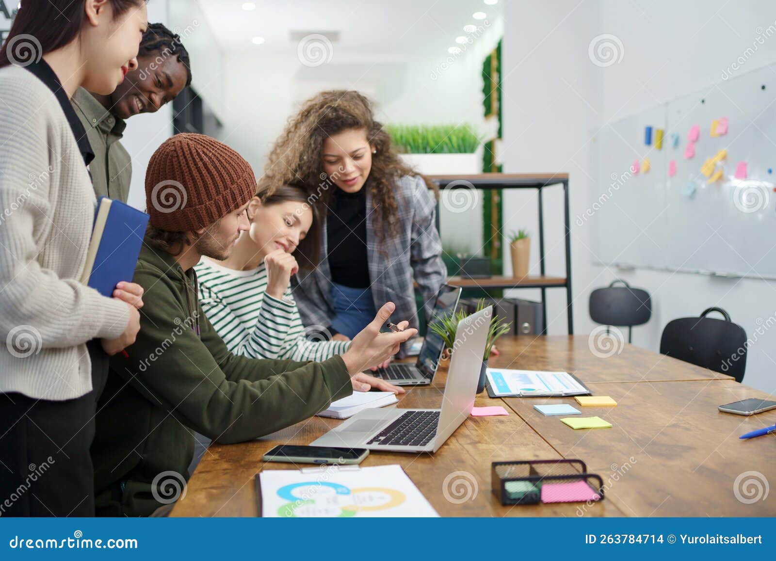 Multicultural Business Team Discussing Current Tasks for a New Project ...