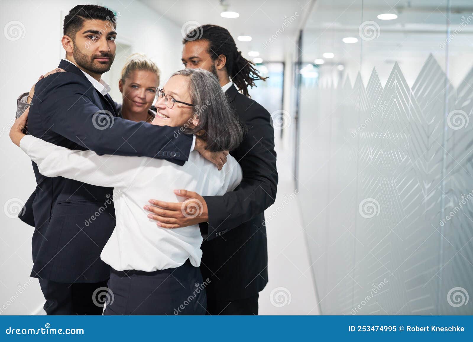 Multicultural Business Team Hugging in a Circle Stock Image - Image of ...