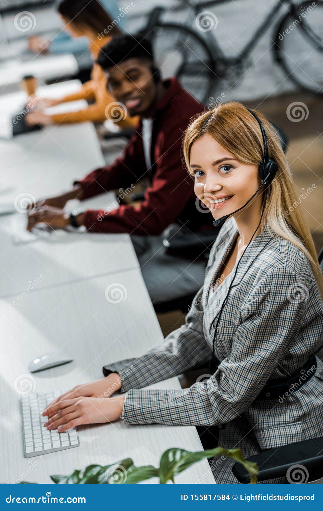 Multicultural Call Center Operators with Headsets at Workpalce Stock ...