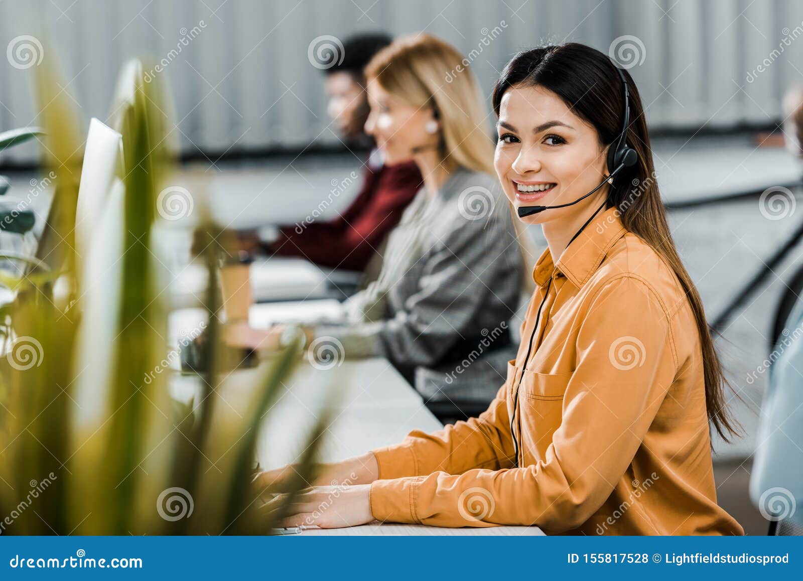 Multicultural Call Center Operators with Headsets at Workpalce Stock ...