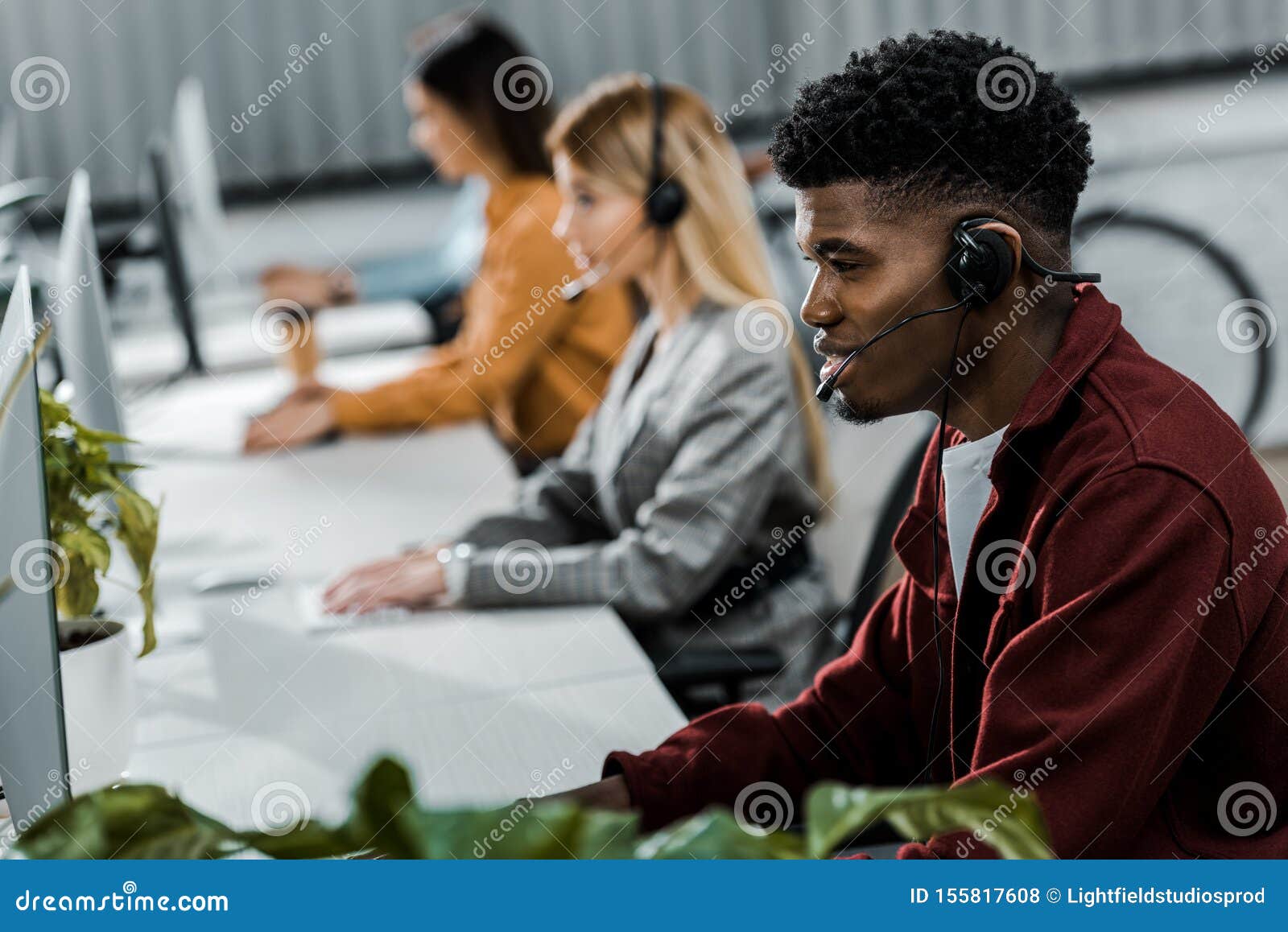 Multicultural Call Center Operators with Headsets at Workpalce Stock ...