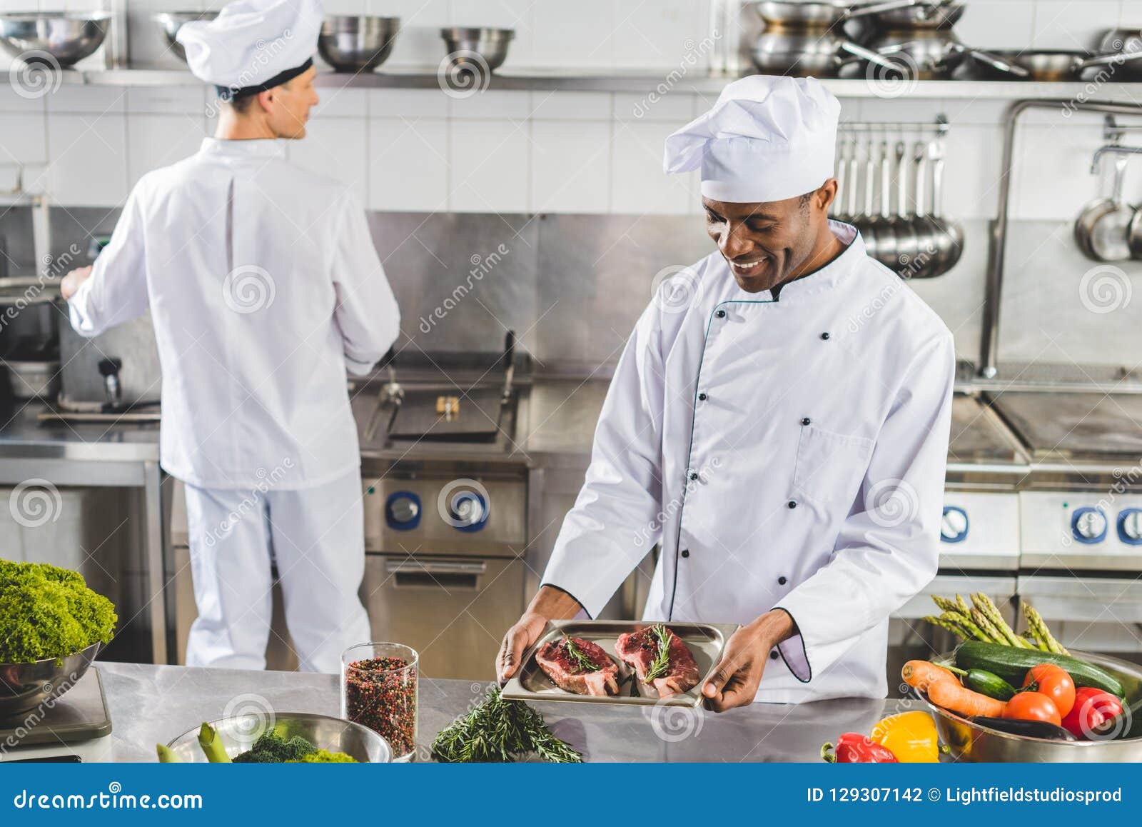 Multicultural Chefs Cooking Meat with Vegetables Stock Photo - Image of ...