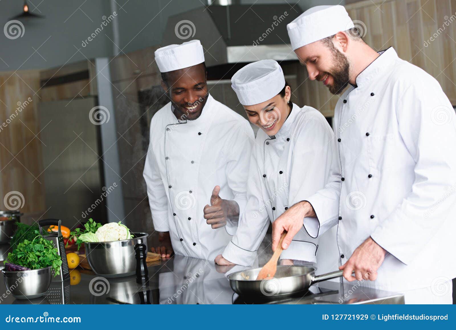 Multicultural Chefs Frying Vegetables on Frying Pan Stock Image - Image ...