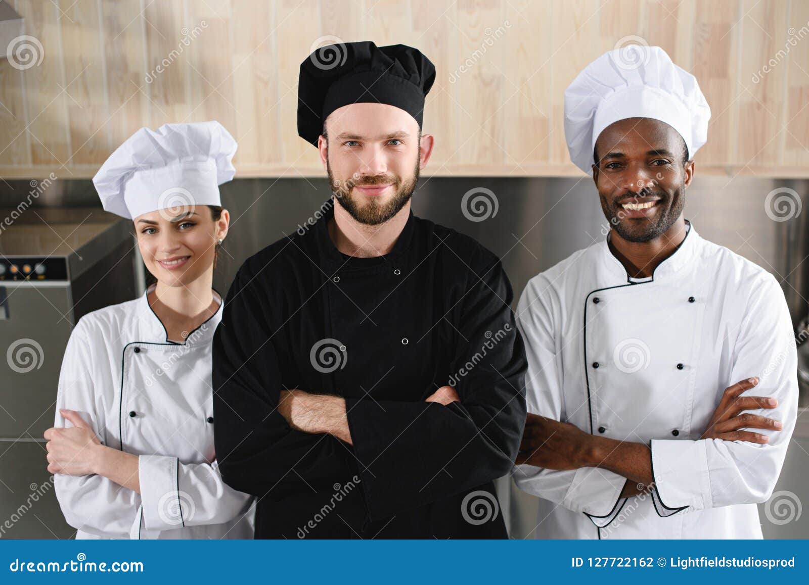 Multicultural Chefs Standing with Crossed Arms and Looking at Camera ...