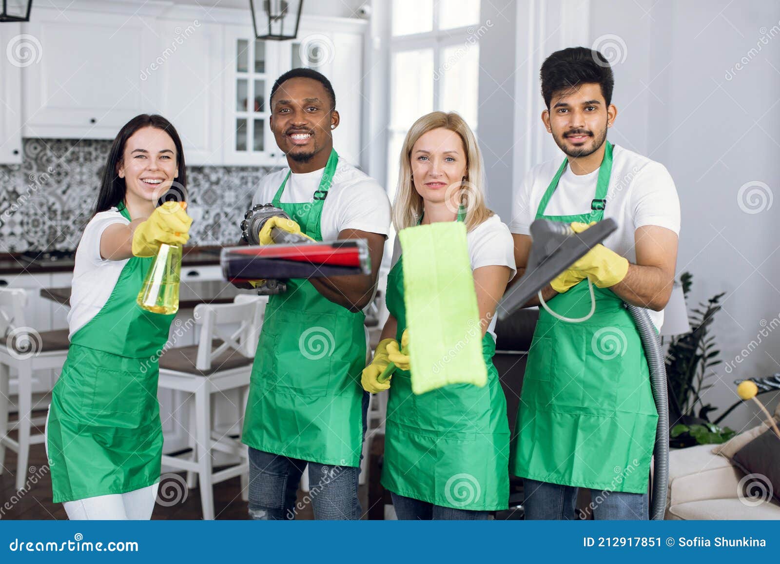Multicultural Cleaners in Green Uniform Posing at Room Stock Image ...