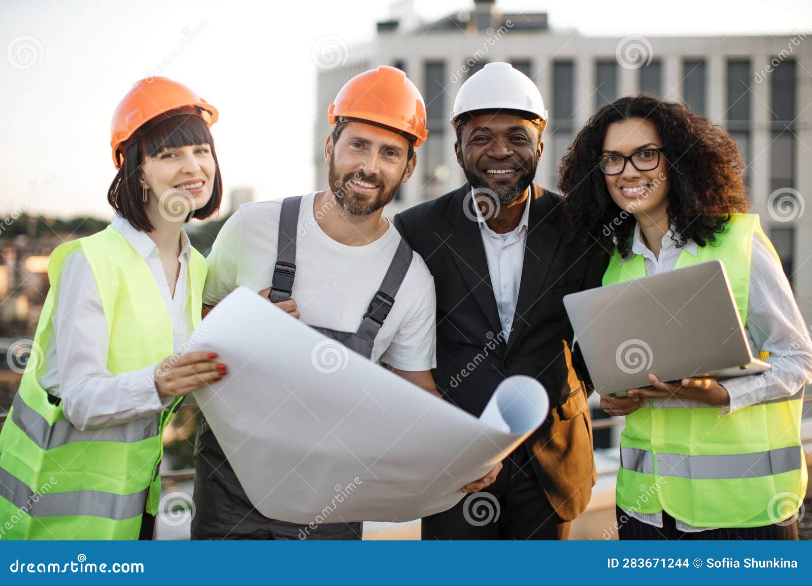 Multicultural Developers Smiling at Camera on Terrace Stock Photo ...