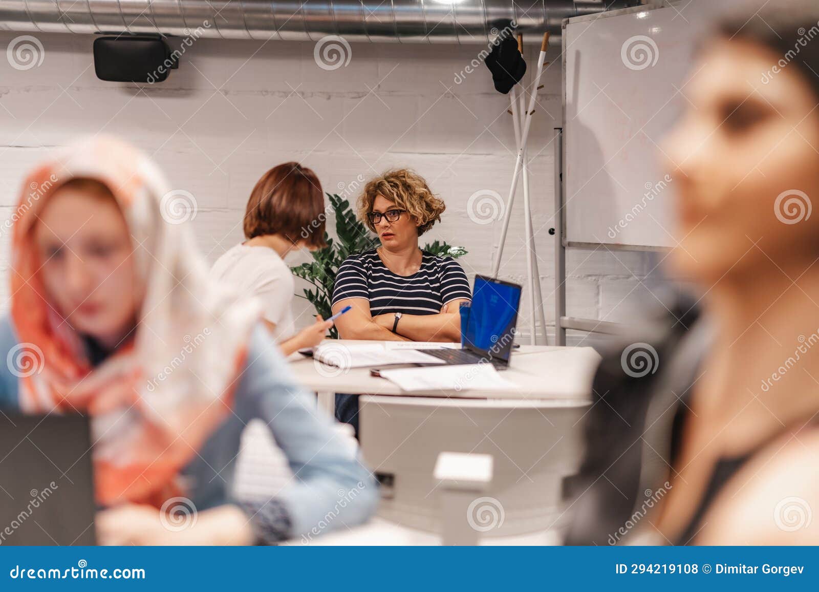 Multicultural Employees Working in Groups at Modern Classroom. Learning ...