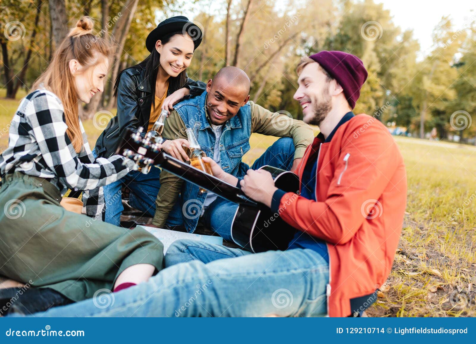 Group of Happy Multicultural Friends Resting Stock Photo - Image of ...