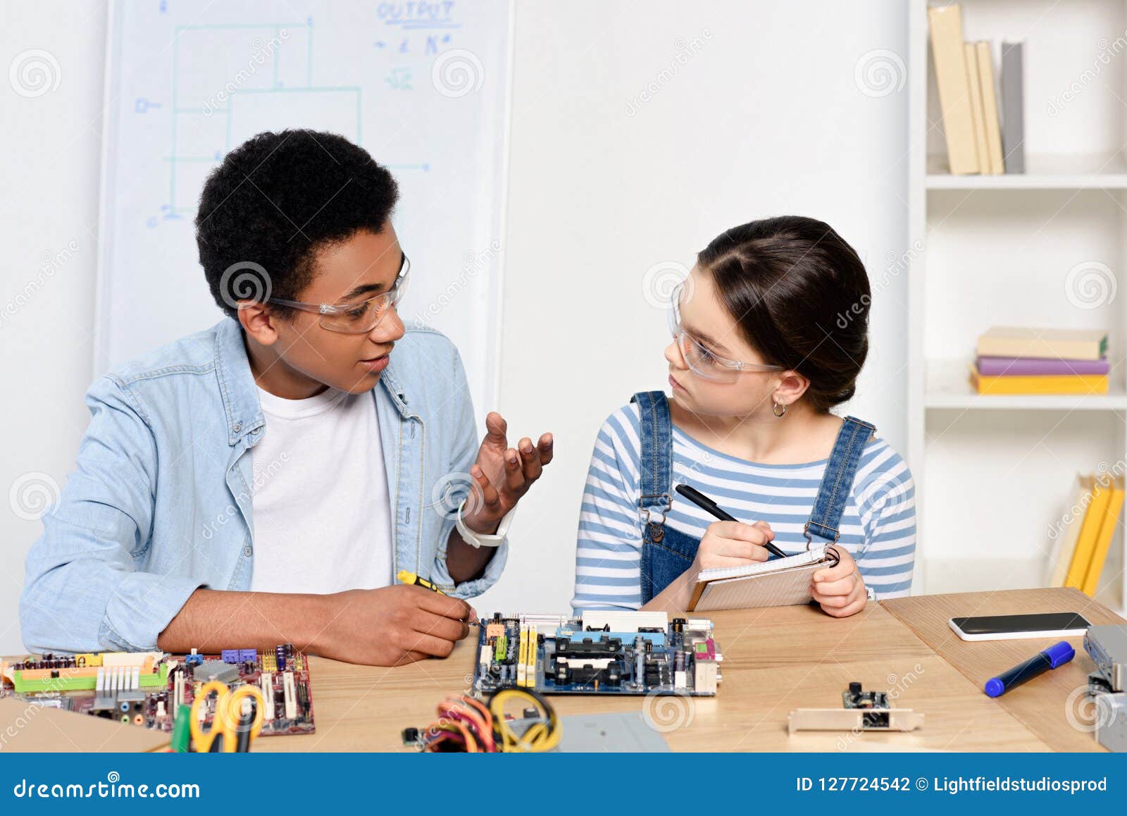 Multicultural Friends Studying and Talking about Computer Motherboard ...