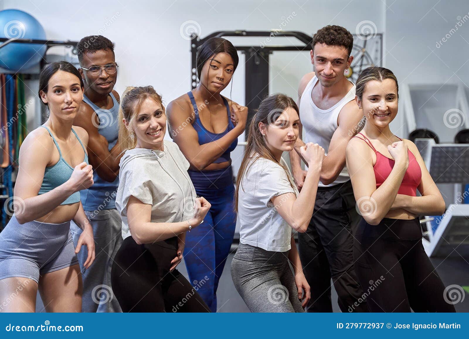 Multicultural Group of Friends at Gym, Flexing Muscles and Smiling for ...