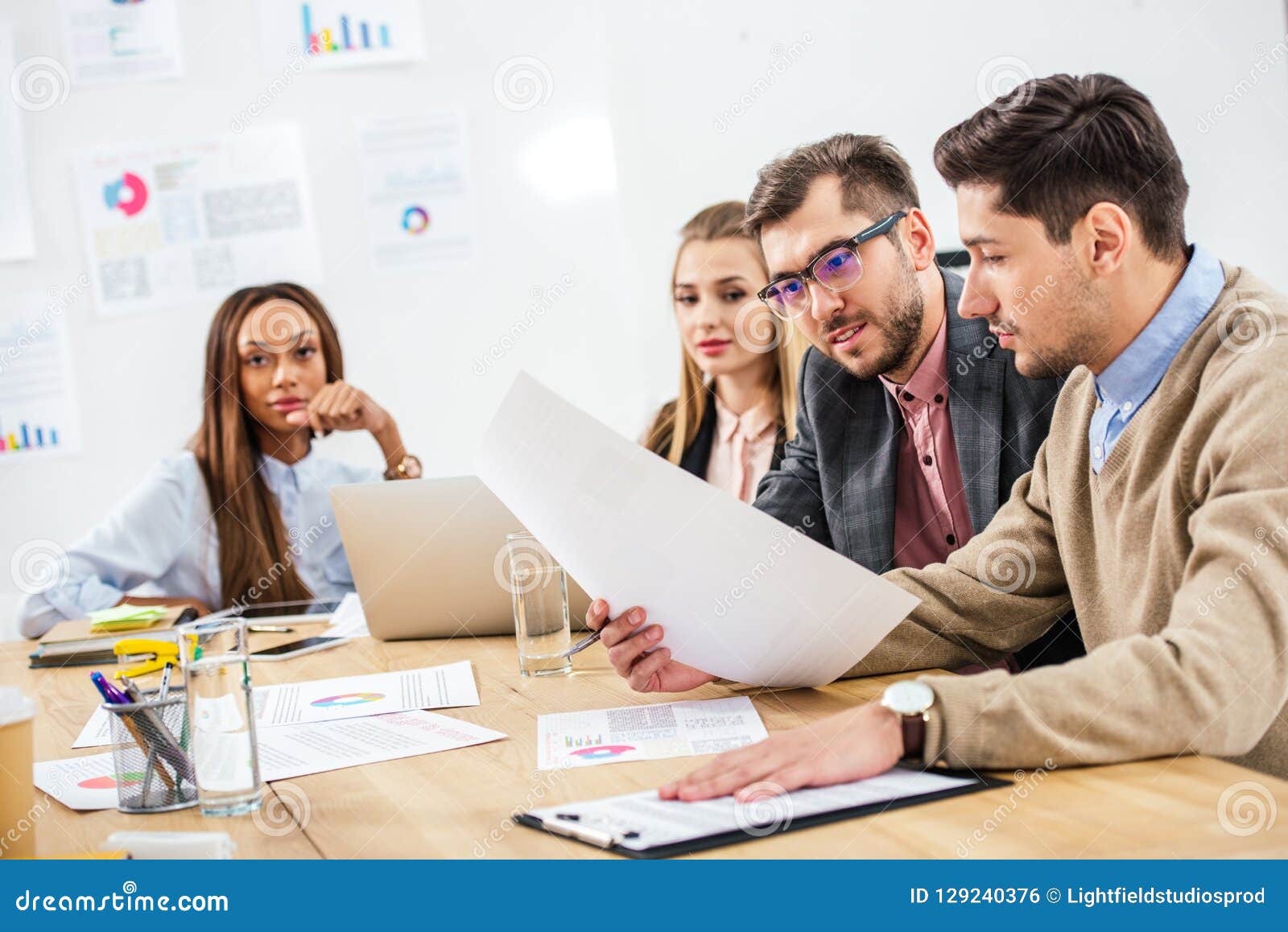 Multicultural Group of Marketing Managers Working on Project Together ...