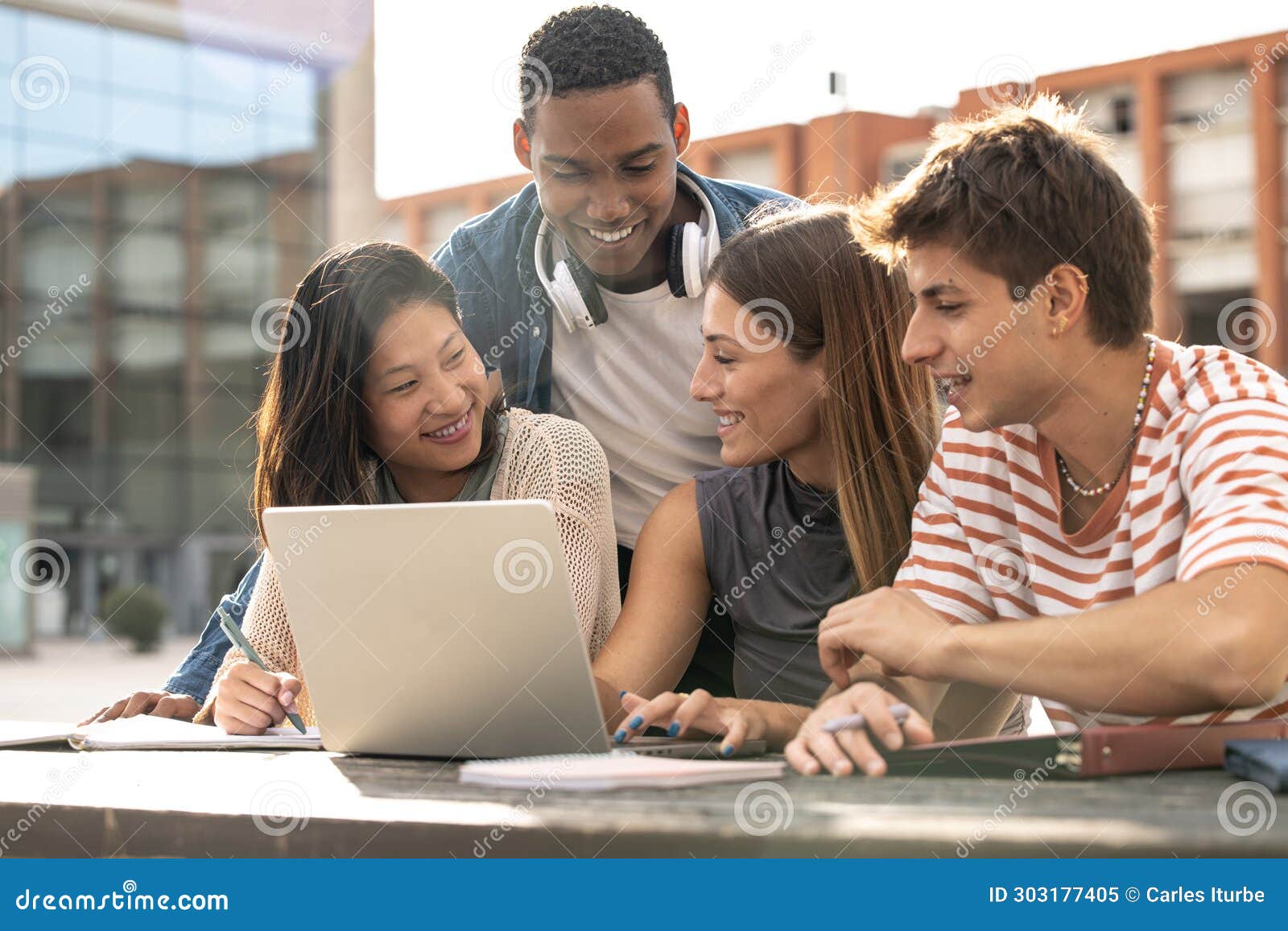 Multicultural Group of People Working Together with a Laptop.Young Happy Friends Studying ...