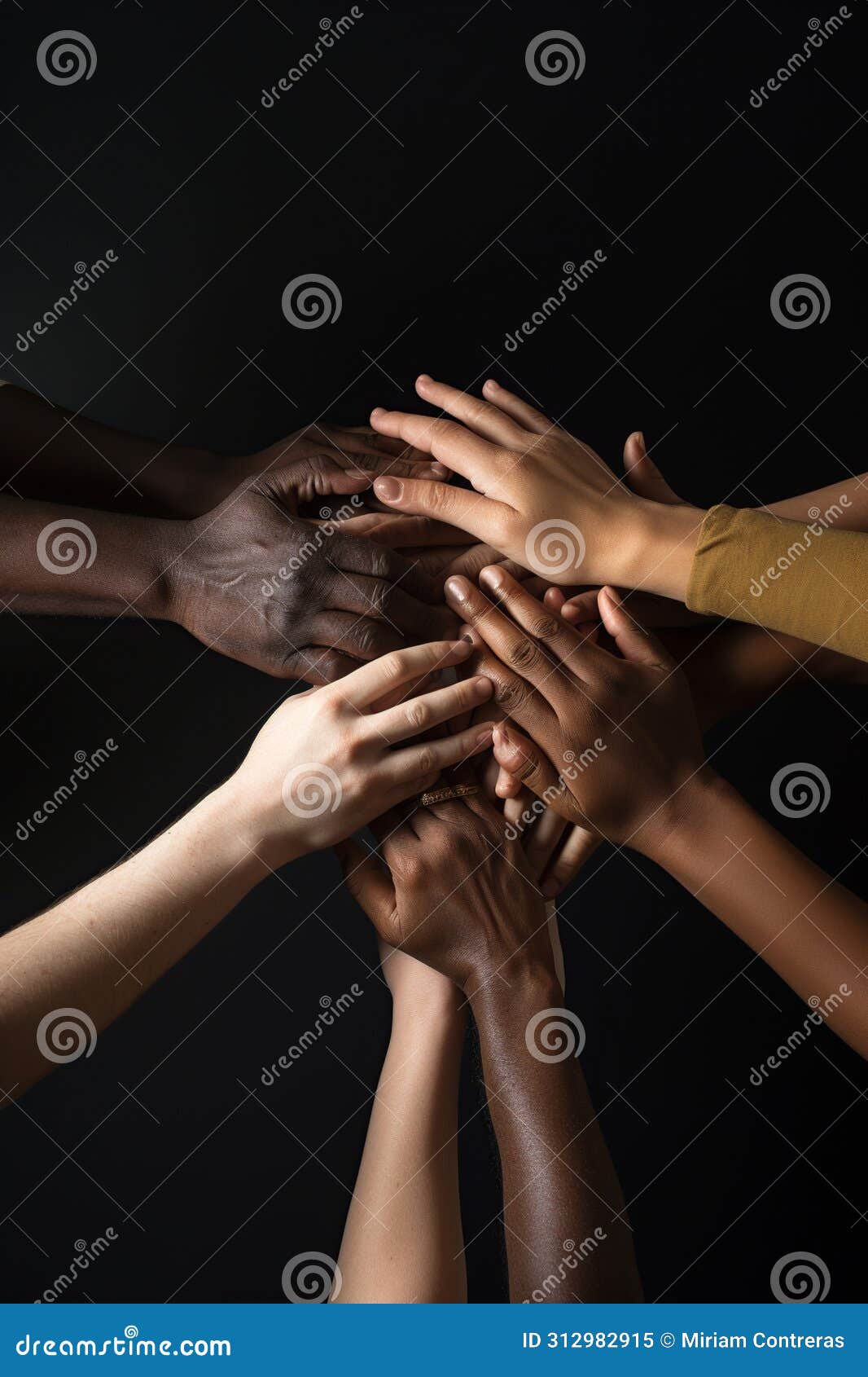 Multicultural Group Placing Hands Together in a Symbol of Unity and ...