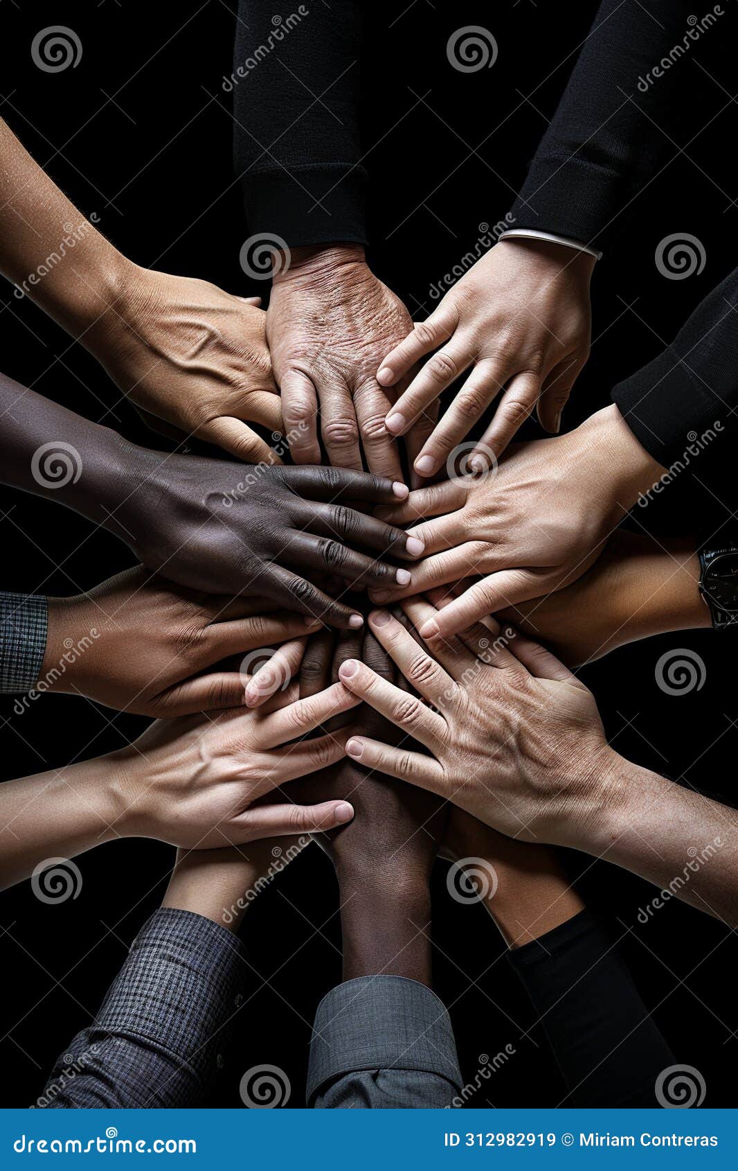Multicultural Group Placing Hands Together in a Symbol of Unity and ...